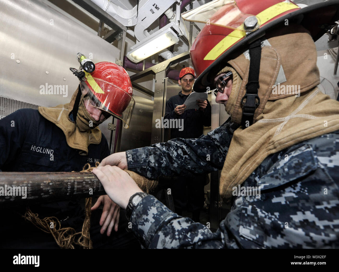 GULF OF OMAN (July 12, 2013)--Sailors simulate patching a pipe during a ...