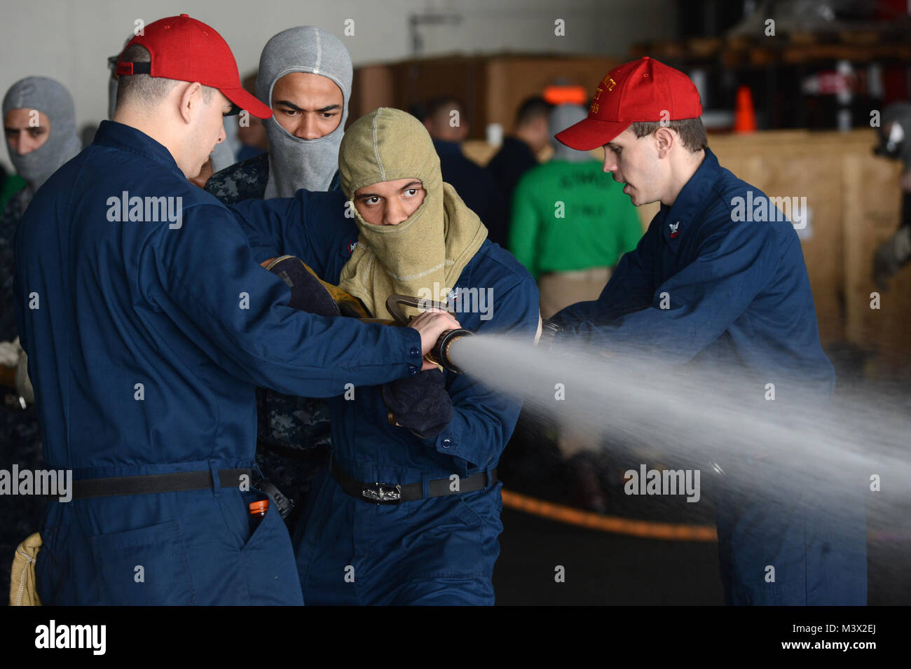 GULF OF OMAN (July 12, 2013) Sailors participate in a firefighting ...