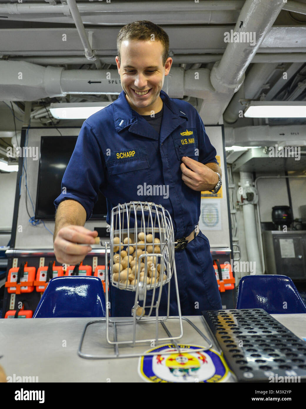 ARABIAN GULF (Aug. 16, 2013) Lt. j.g. Brian Scharp spins a bingo wheel ...