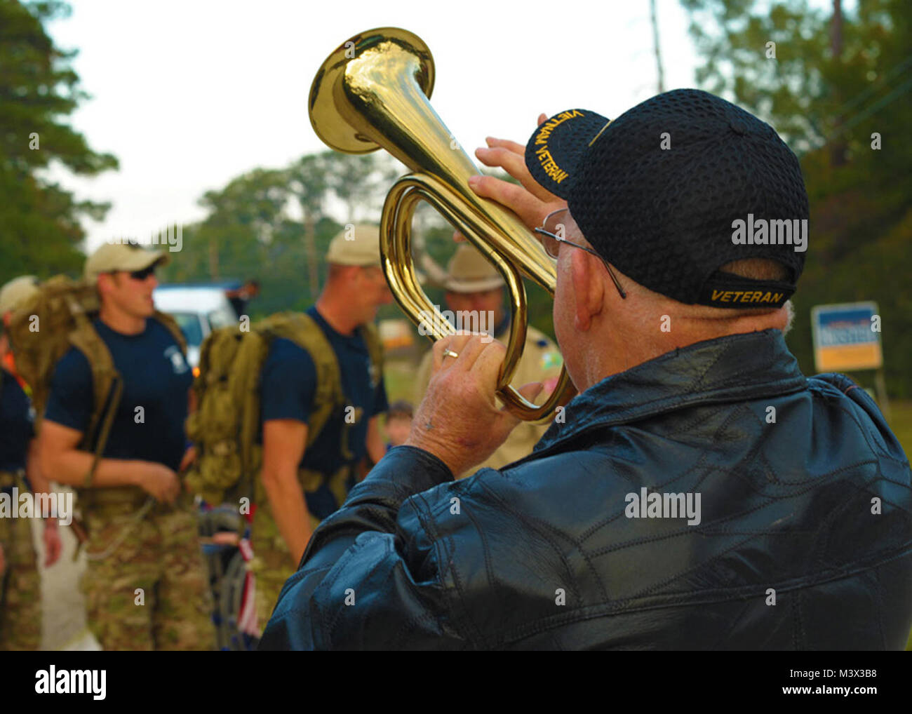 Retired U.S. Navy Chief Petty Officer Charles Ledet (right), plays ...