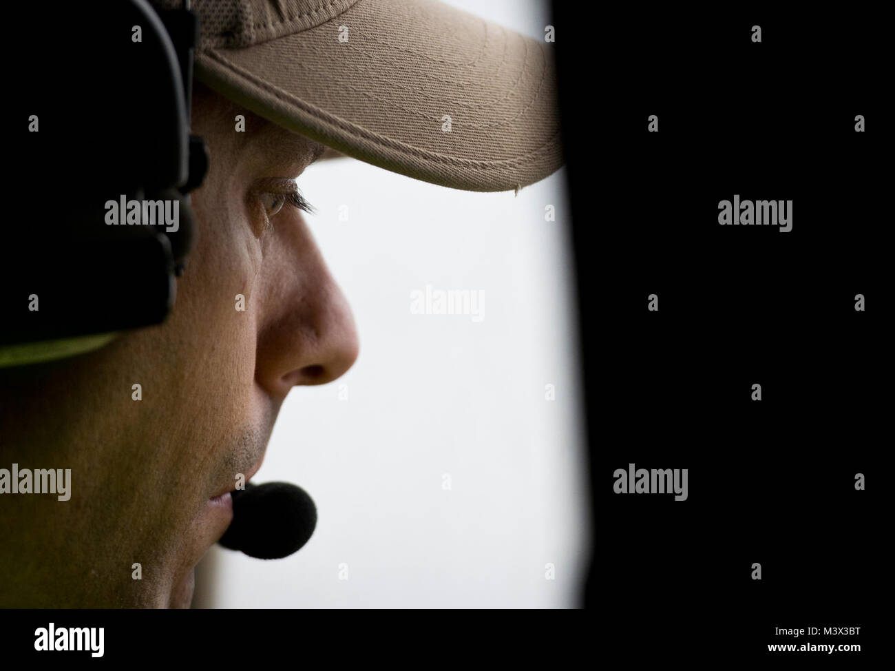 Tech Sgt. Jason Dykstra looks out the window of an HC-130N King in ...