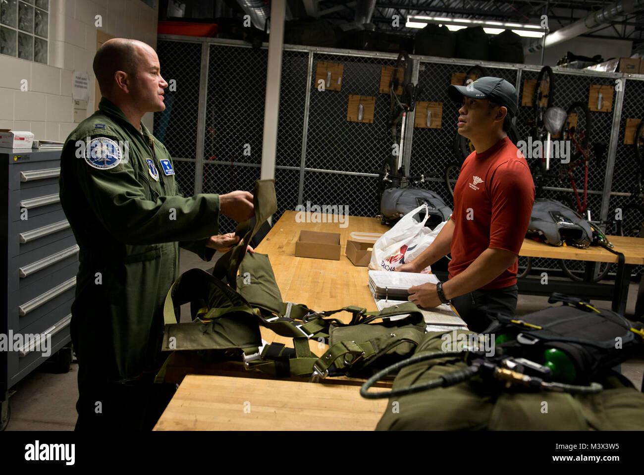Capt. John Romspert (left) and Master Sgt. Leovan Claunan prepare their ...