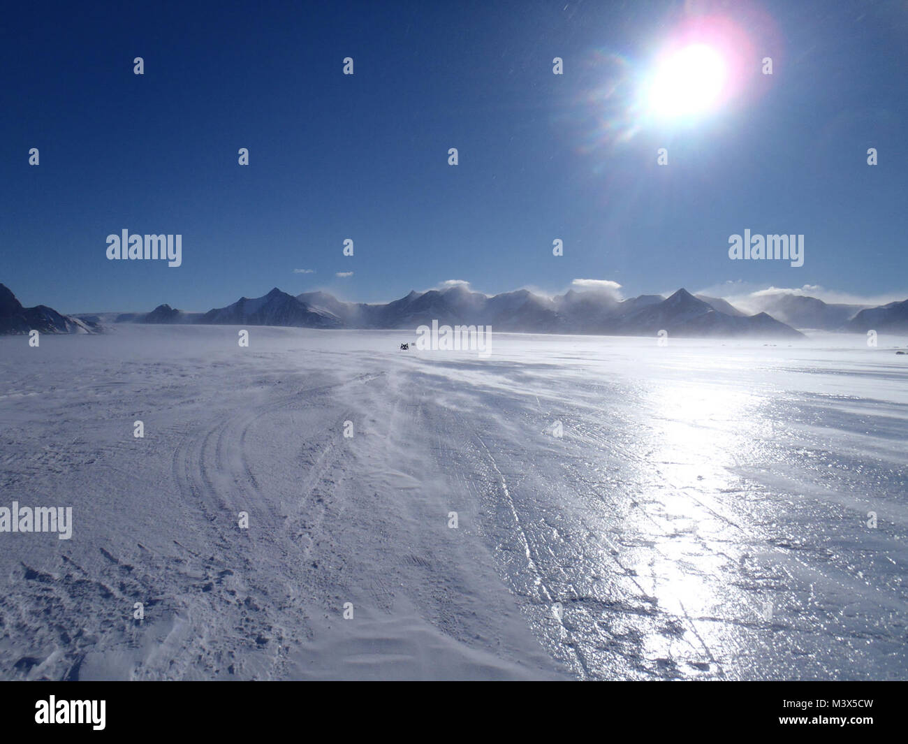 Snow blows across a blue ice runway in Antarctica. 00124 by ...