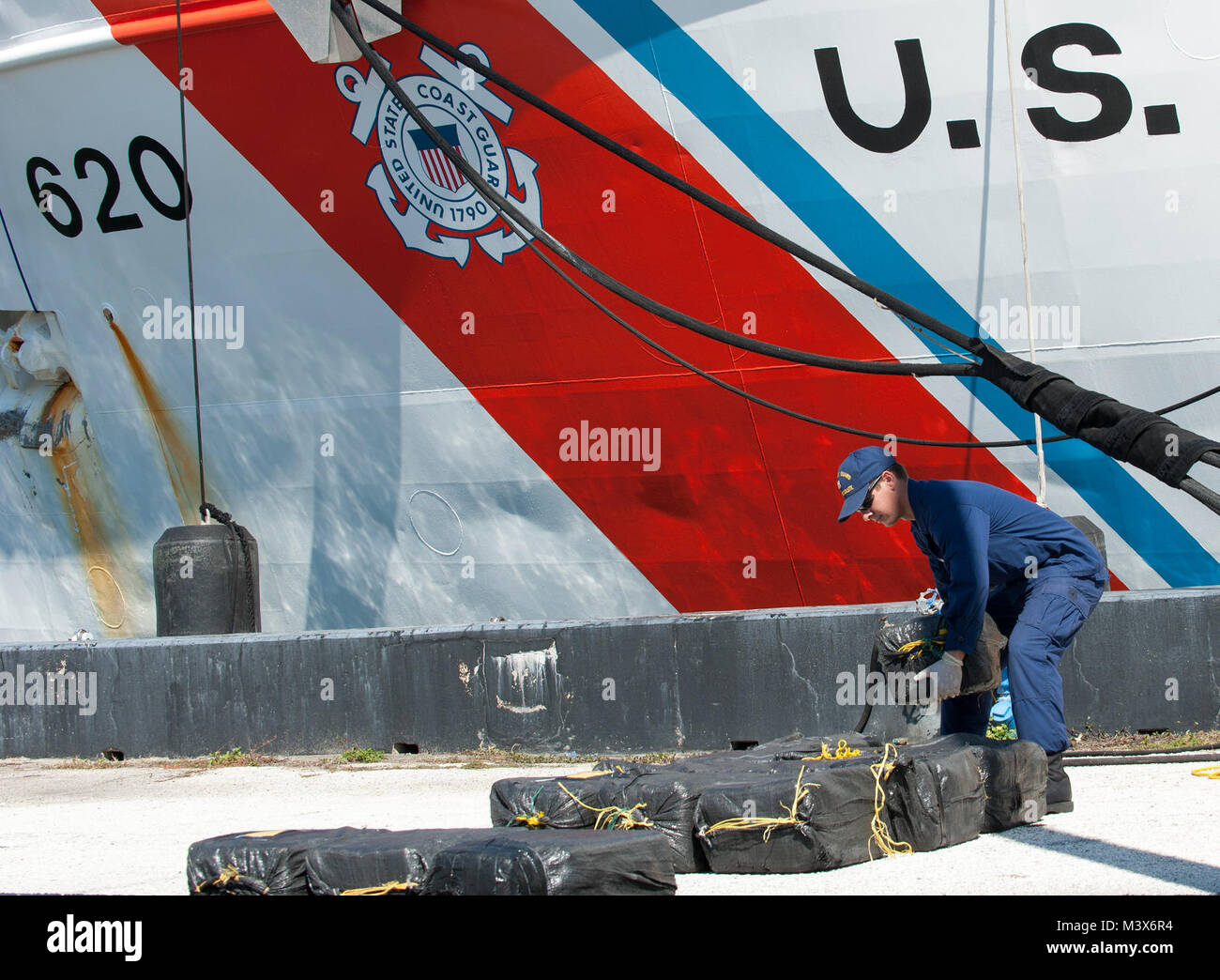 Crew members aboard the Coast Guard Cutter Resolute, a 210-foot ...