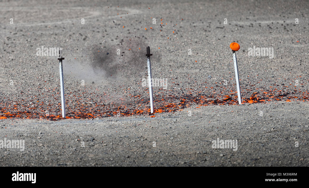 Clay shattered during a clay stage during a three gun match Stock Photo ...