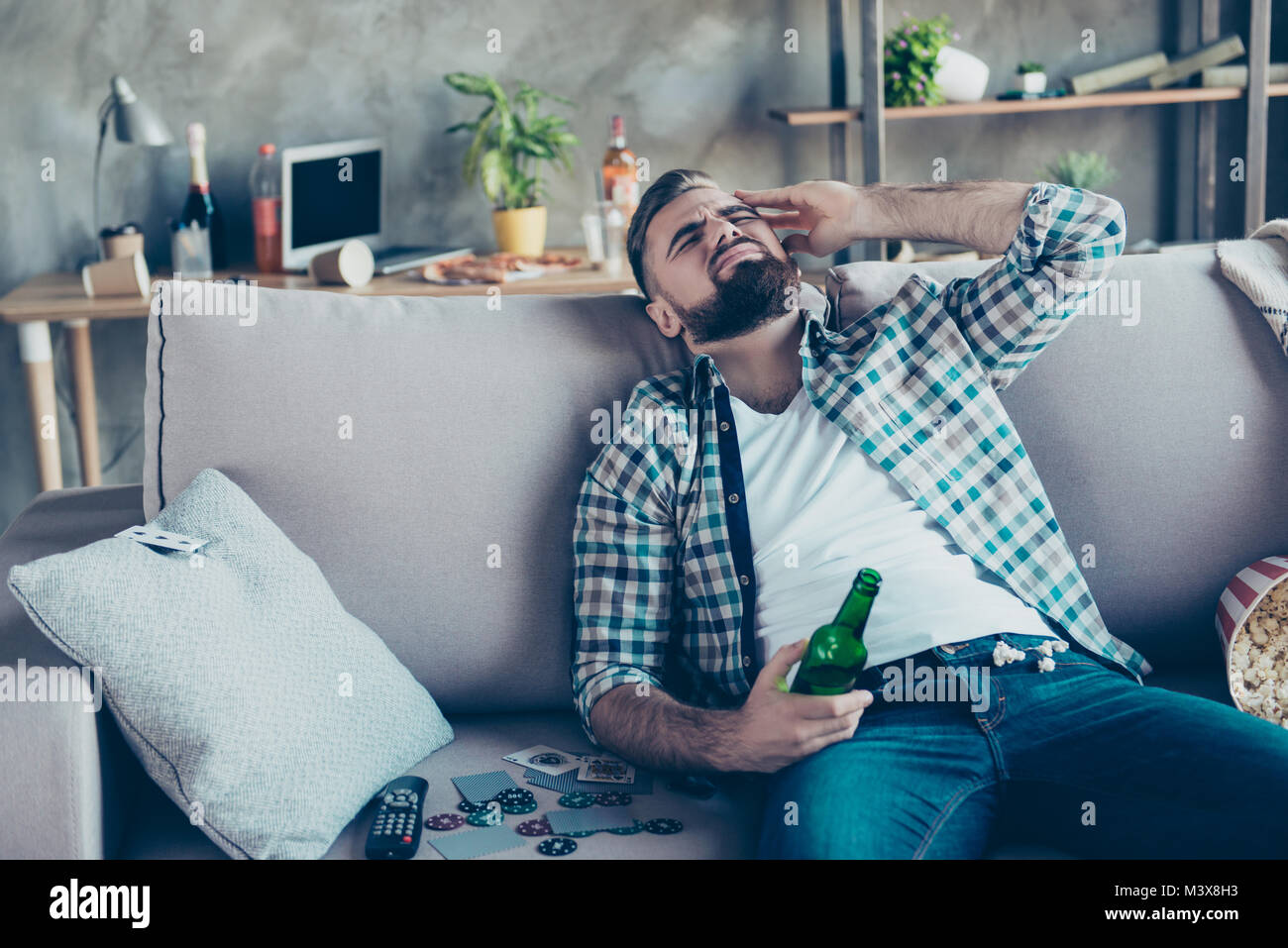 Handsome, stylish man suffering from headache after night party in the ...