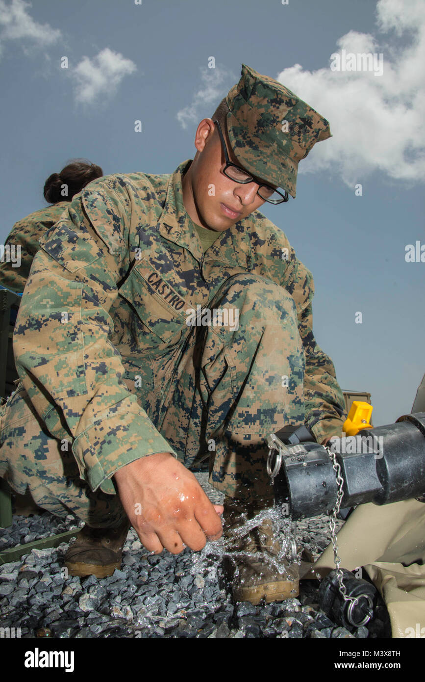 Lance Cpl. Esgar Castro, a water support technician assigned to 8th ...