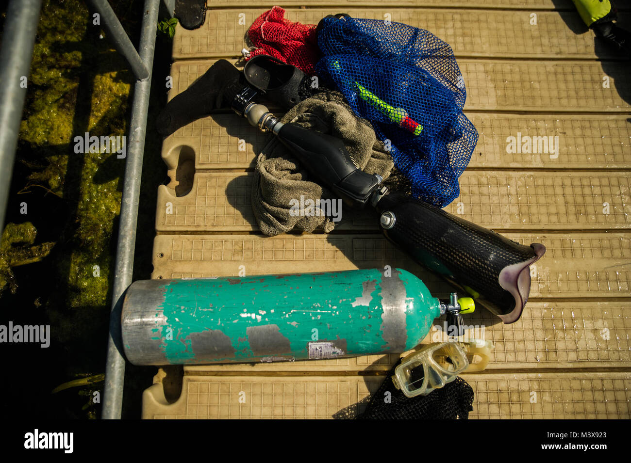A prosthetic leg lays on the dock while Wounded Warriors participate in ...