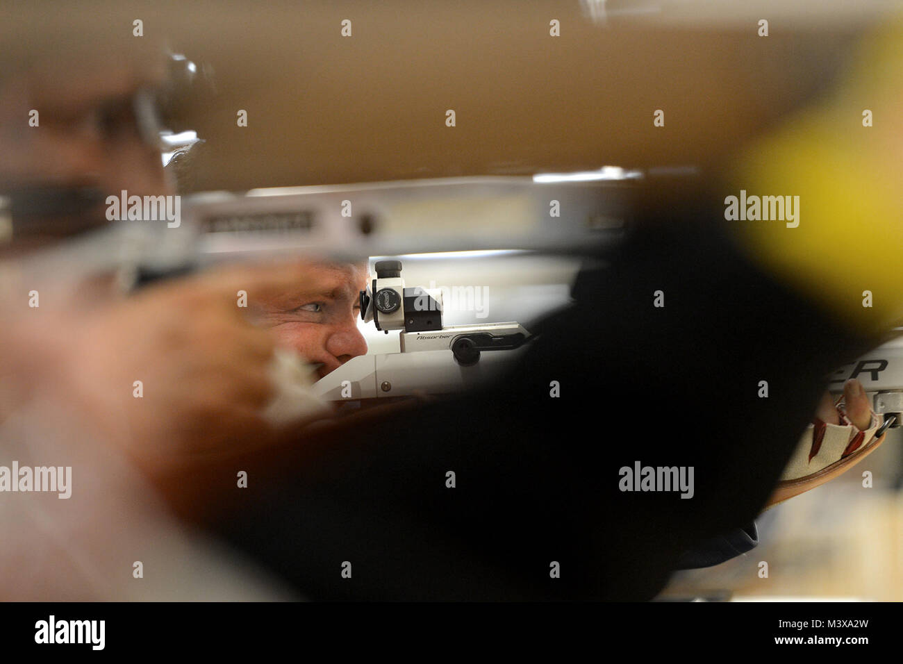 Army Sgt. First Class Joshua Bendell fires and air rifle during ...