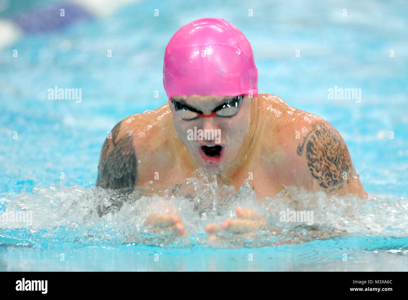 Marines Cpl. Kyle Reid swims to gold in his division of the 50 meter ...