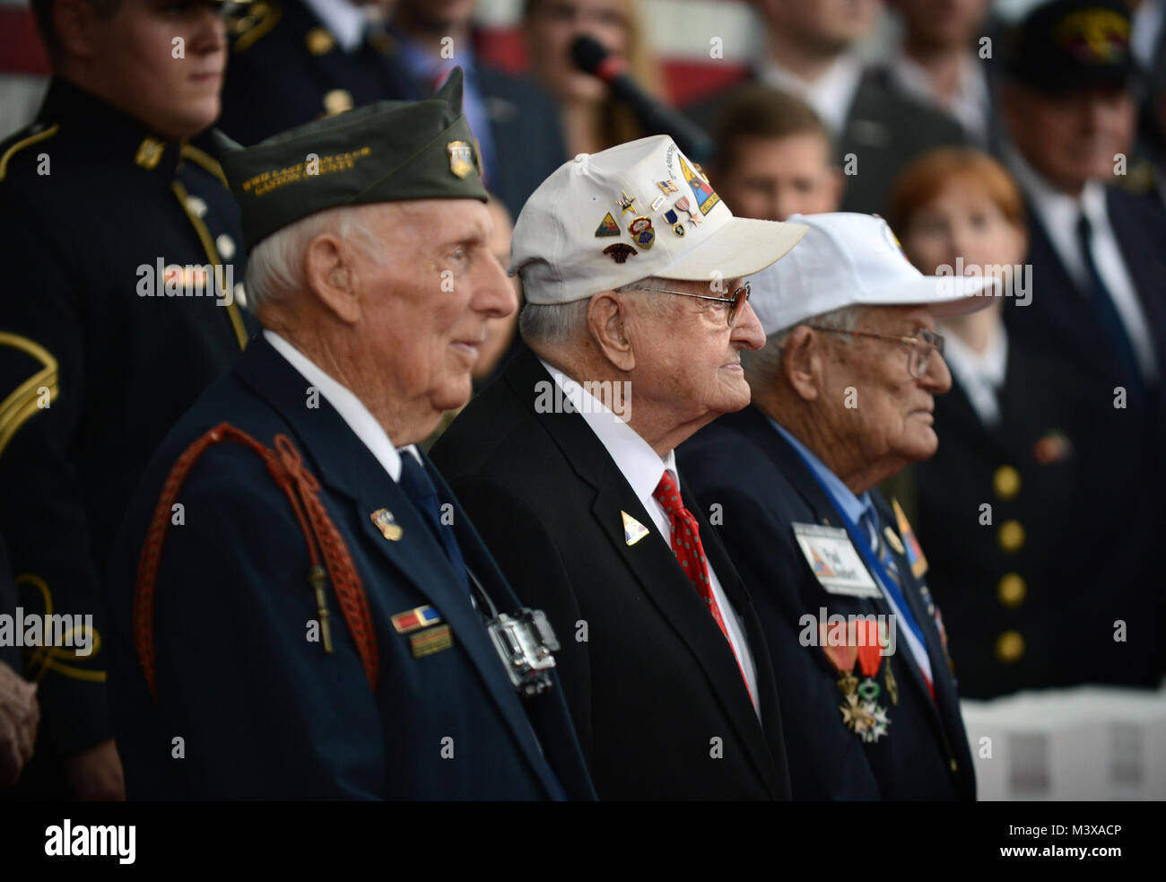 Retired World War II veterans along with active duty military personnel ...
