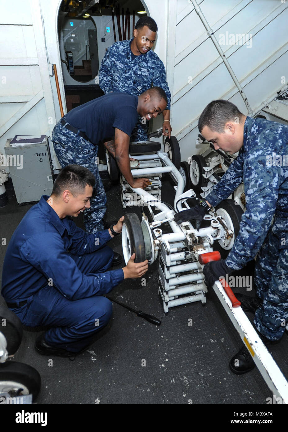 PACIFIC OCEAN (Oct. 16 2014) – Sailors configure a bomb skid in the ...