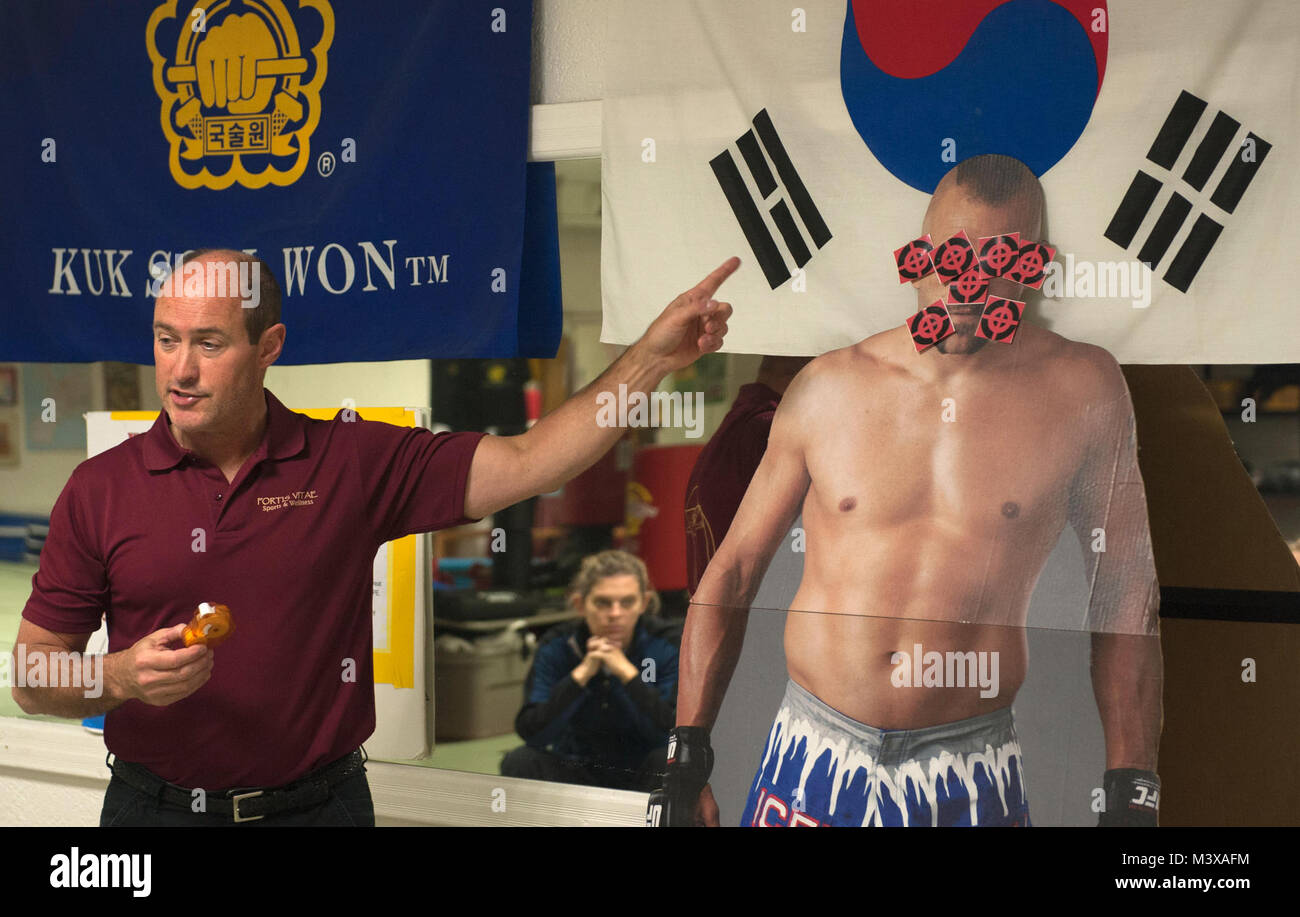 Mr. Mike Grimes, a Kuk Sool Won martial arts instructor, shows a group ...