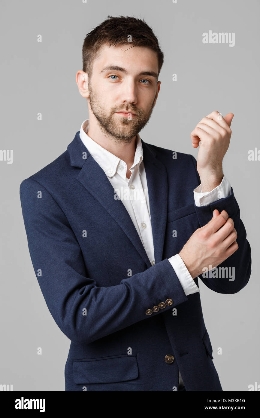 Business Concept - Young successful businessman posing over dark ... Business Concept - Young successful businessman posing over dark ...