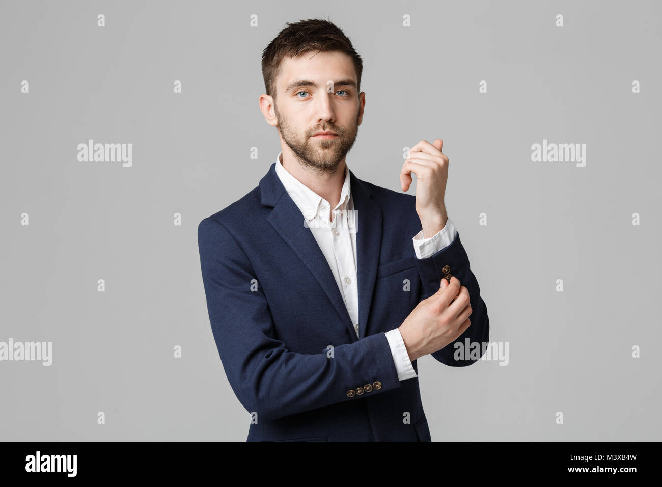 Business Concept - Young successful businessman posing over dark ... Business Concept - Young successful businessman posing over dark ...
