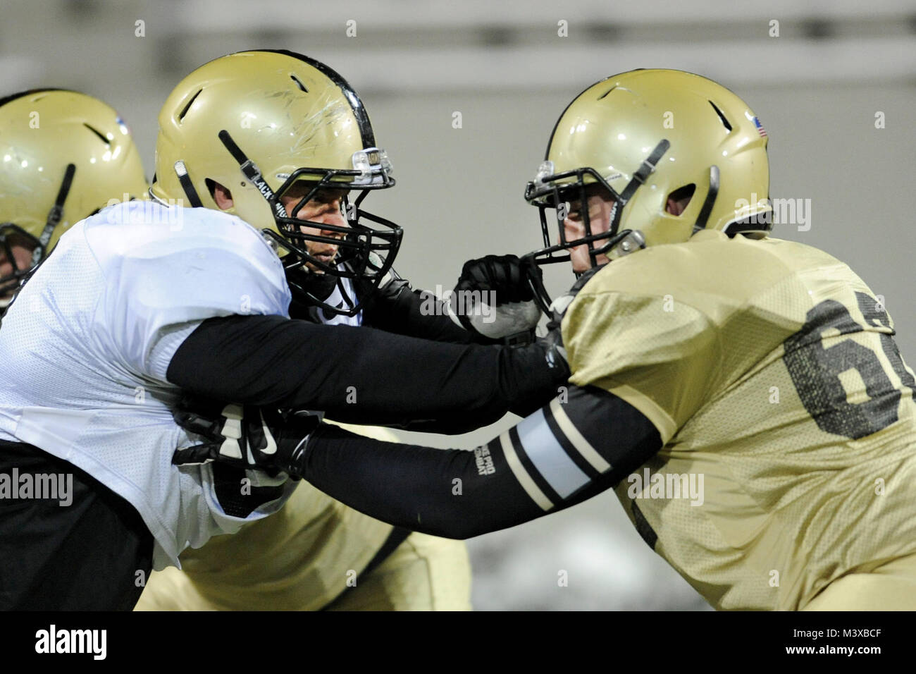 Army defensive end Robert Kough, left, works out with his teammate Tim ...