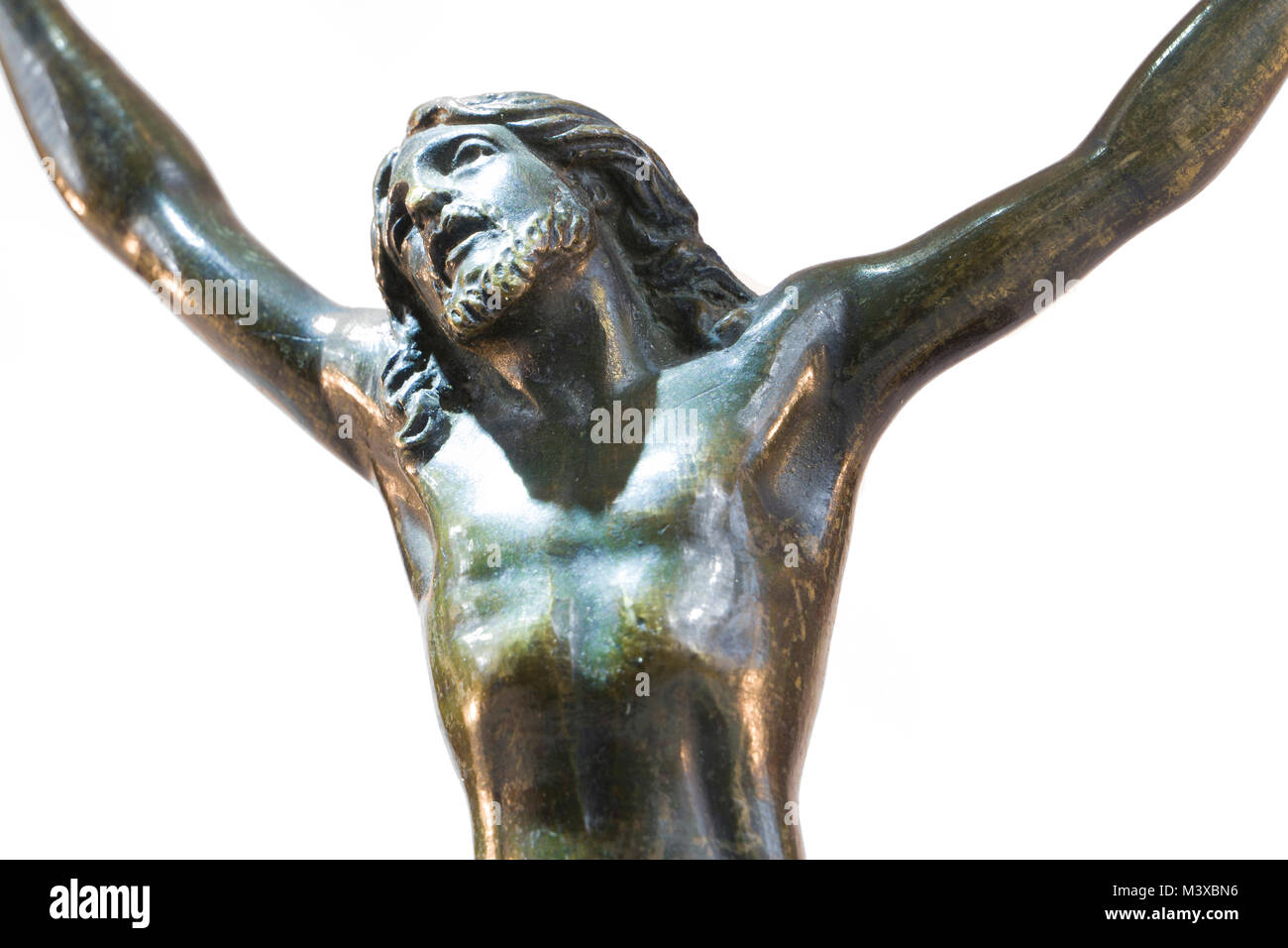 Close up of the face of Jesus on the cross against a white background ...