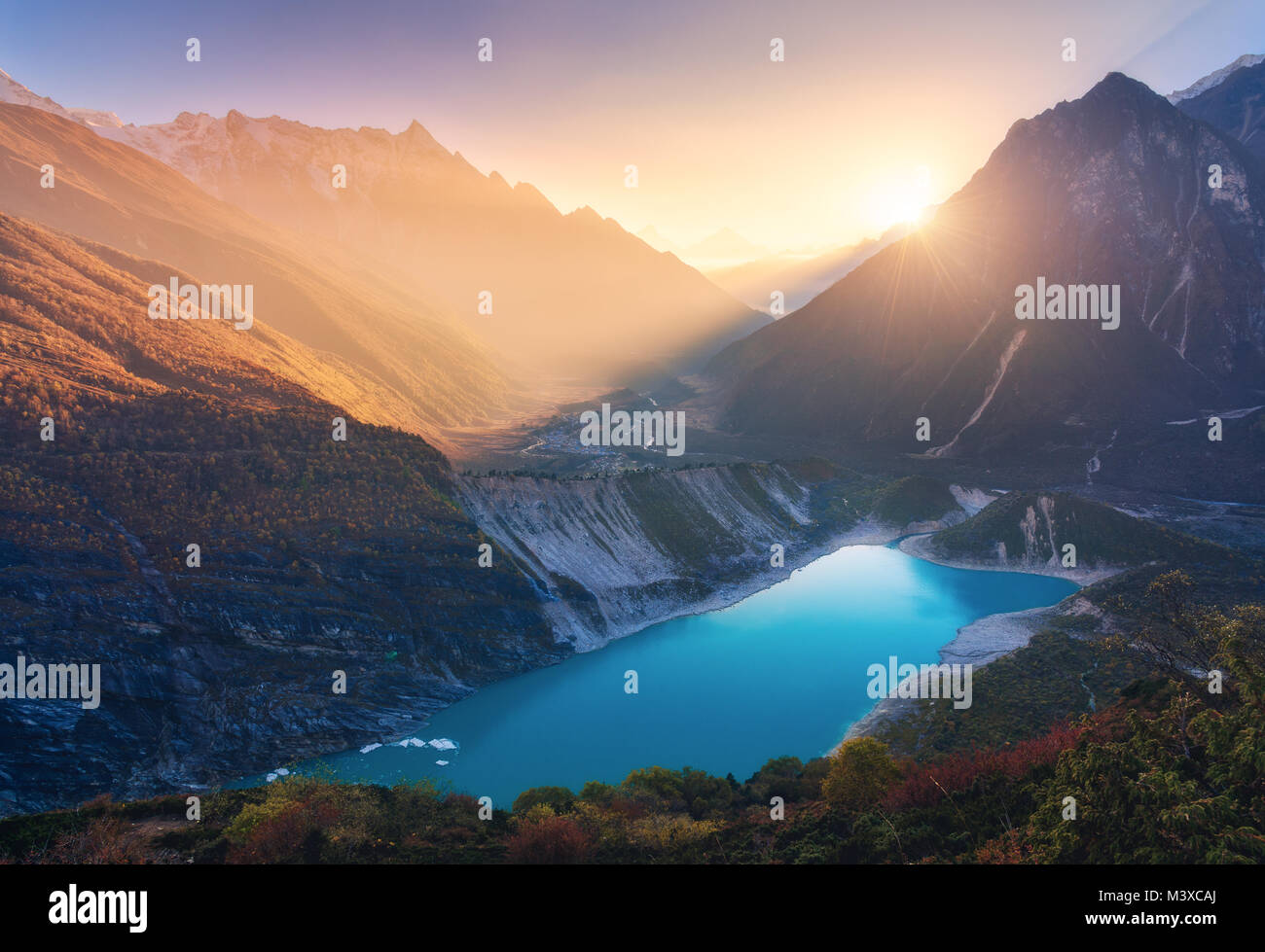 Mountains and lake with blue water at sunset in Nepal. Majestic ...