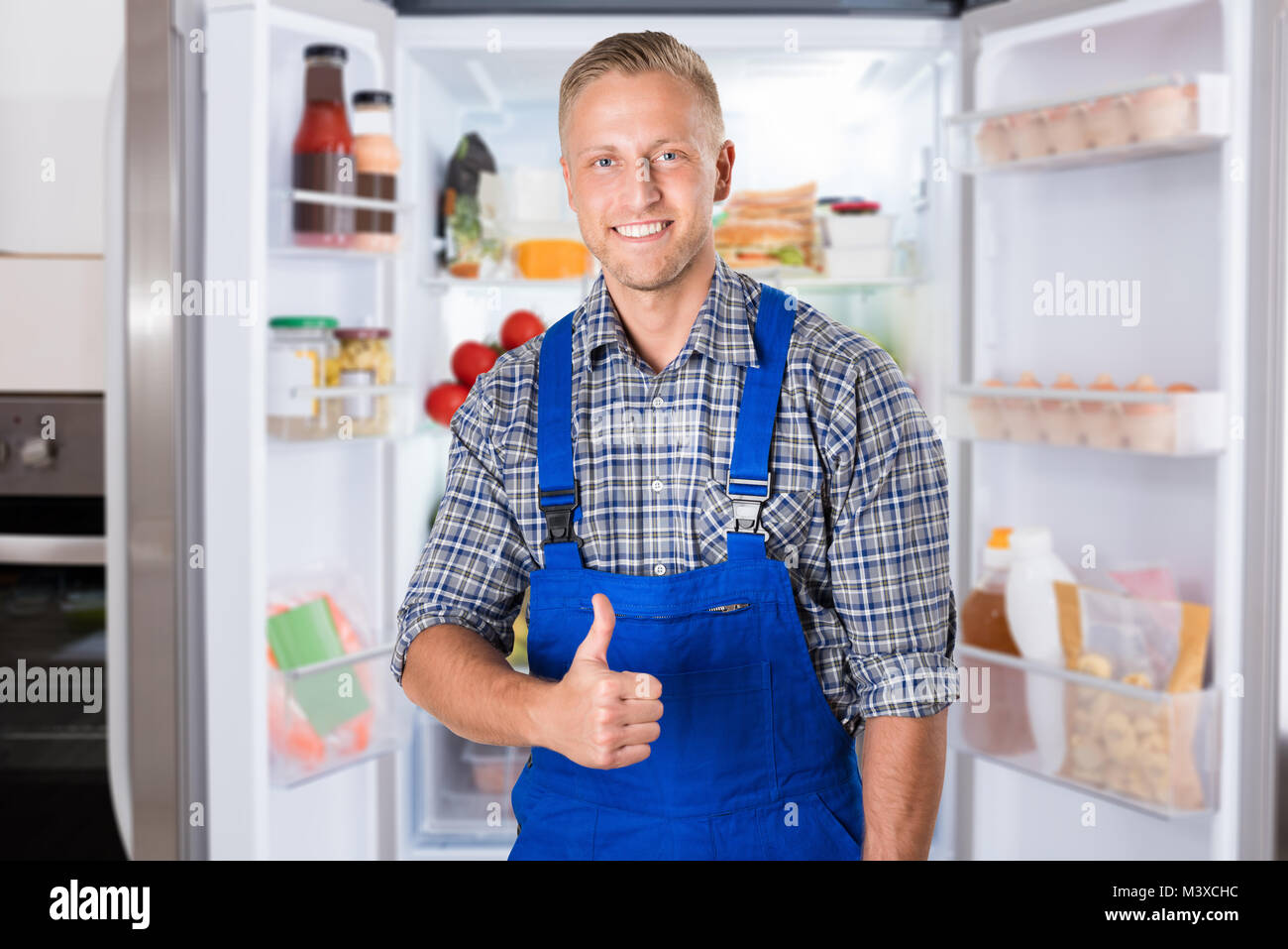 Man standing front fridge hi-res stock photography and images - Alamy