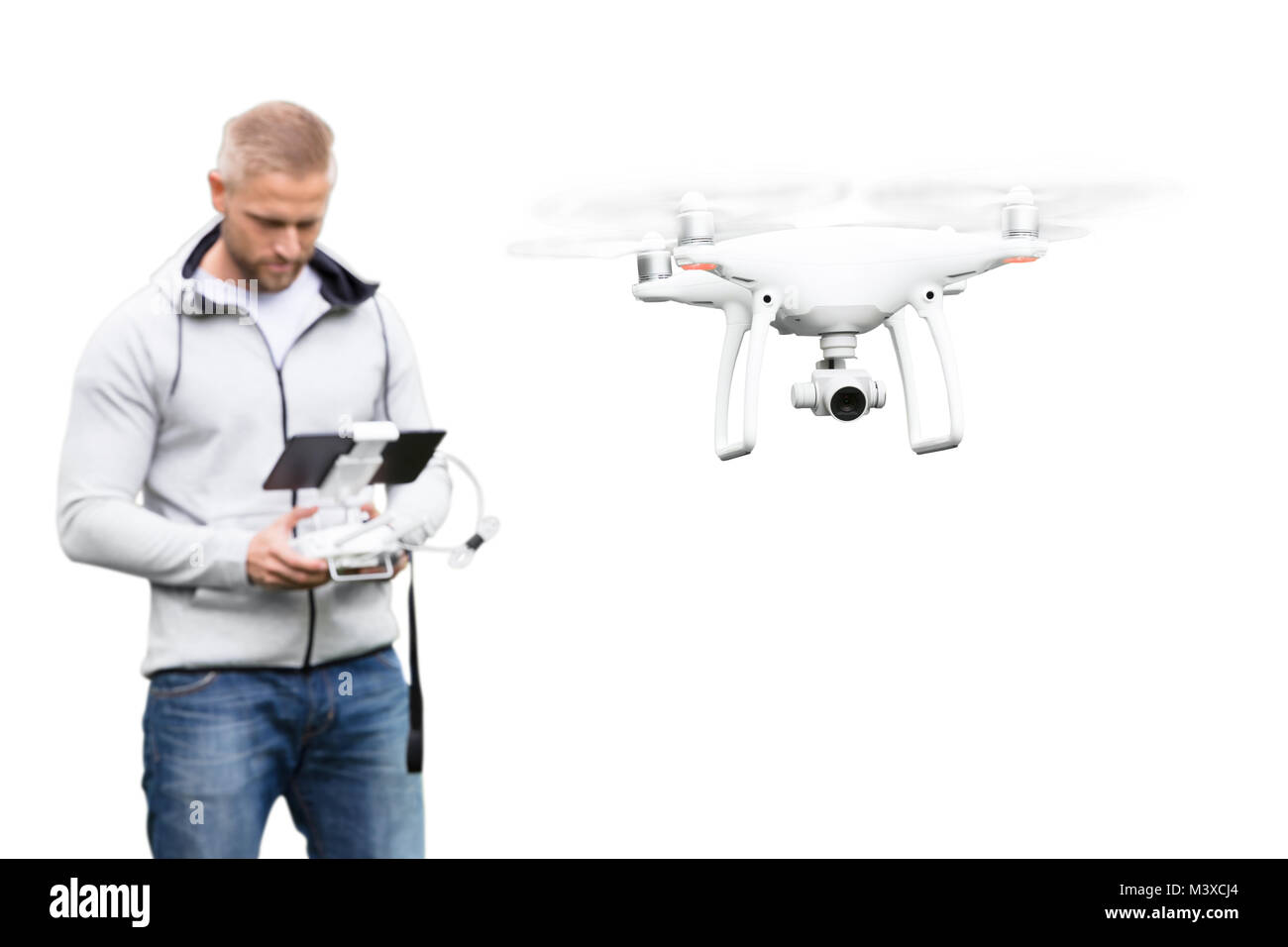 Young Man Operating Drone On White Background Stock Photo - Alamy