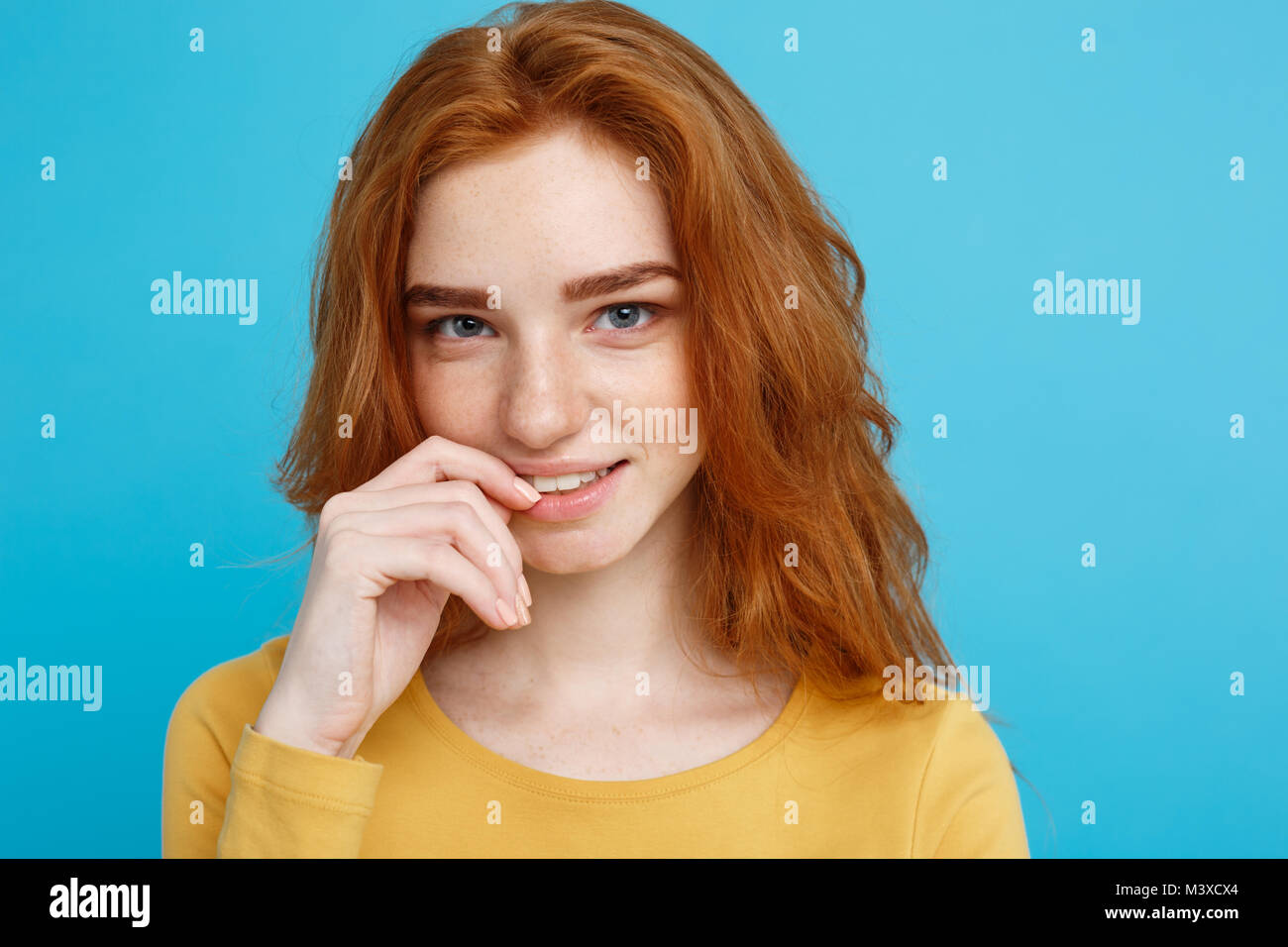Headshot Portrait of happy ginger red hair girl with freckles smiling ...