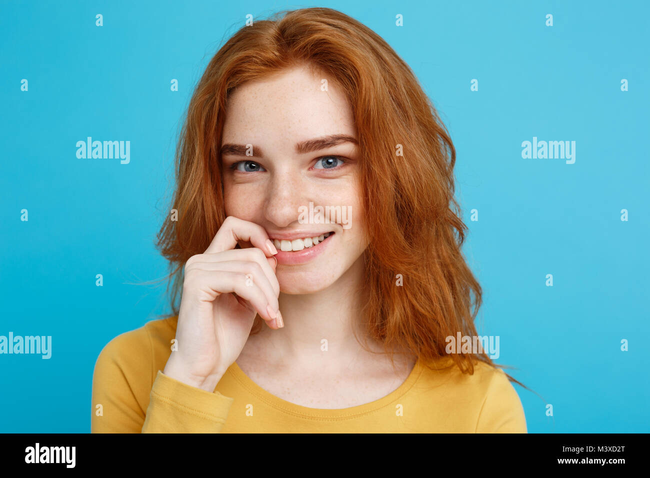 Headshot Portrait of happy ginger red hair girl with freckles smiling ...