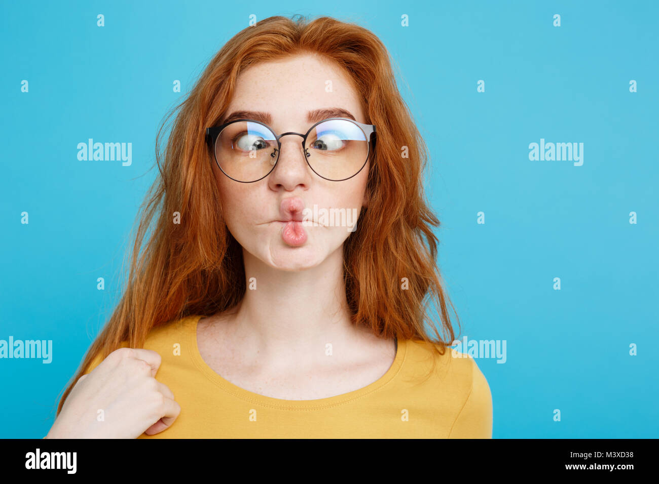 Headshot Portrait of happy ginger red hair girl with freckles smiling ...