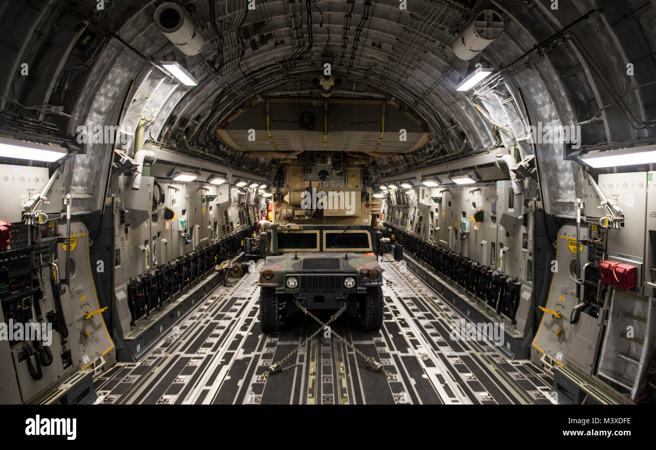 A Humvee sits in the cargo hold of a U.S. Air Force C-17 Globemaster ...
