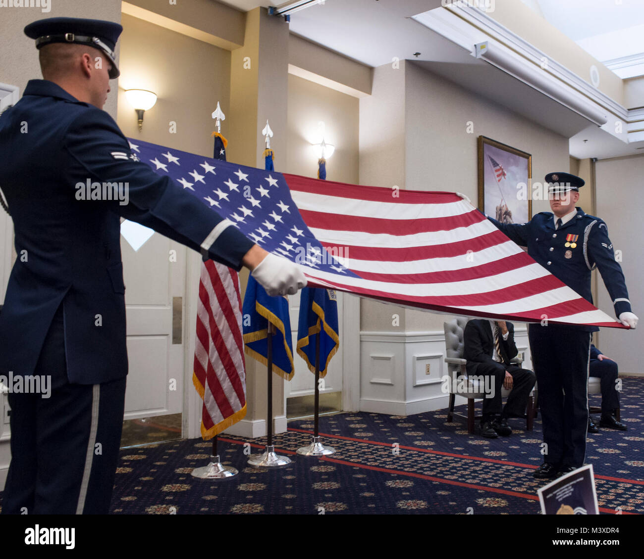 U.S. Air Force Honor Guard present the U.S. flag during a retirement ...