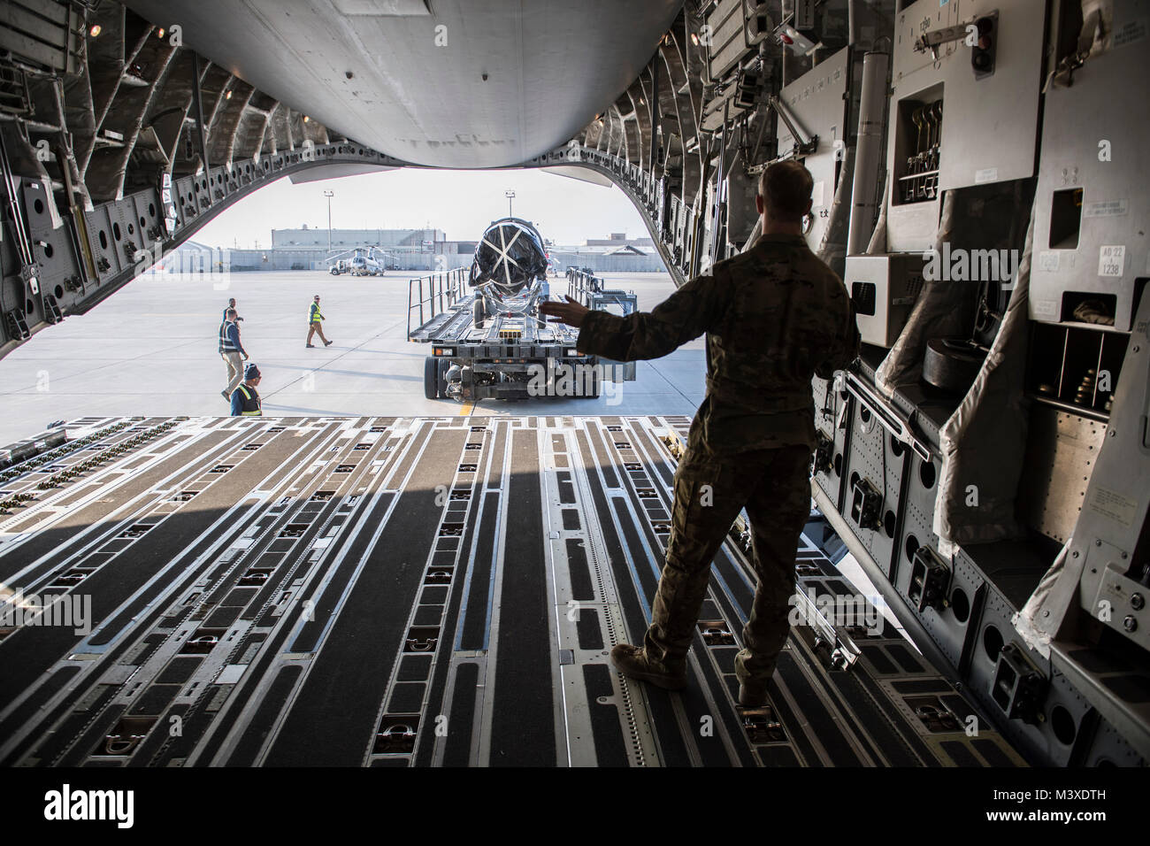 A U.S. Air Force C-17 Globemaster III loadmaster, assigned to the 816th ...