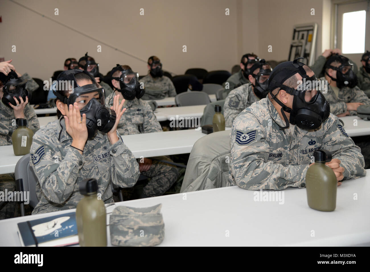 Team Dover Airmen don gas masks during a Chemical, Biological ...