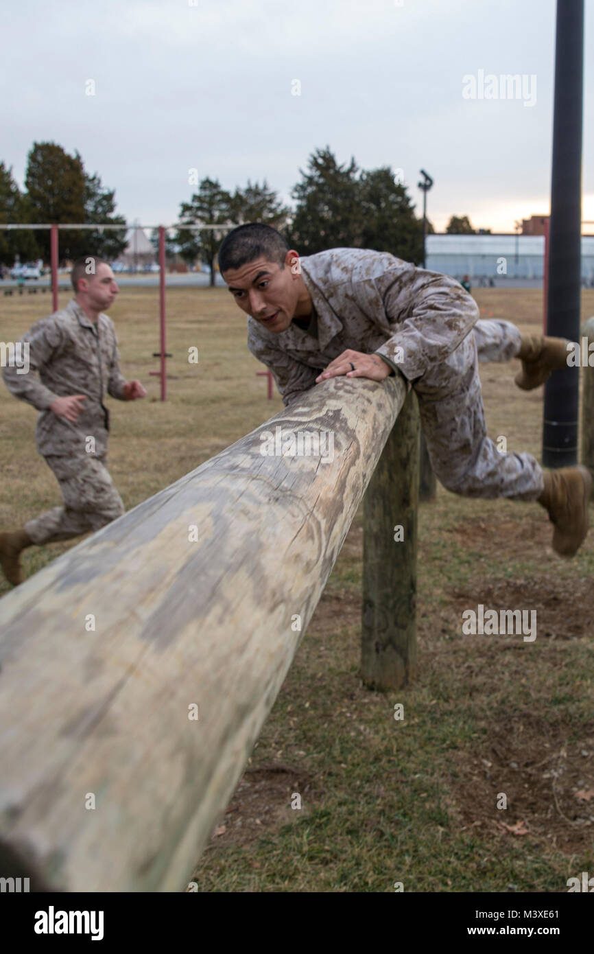 U.S. Marine Corps officer candidates participate in an obstacle course ...