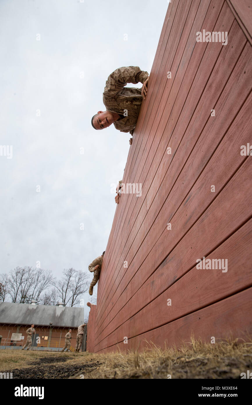 U.S. Marine Corps officer candidates participate in an obstacle course ...