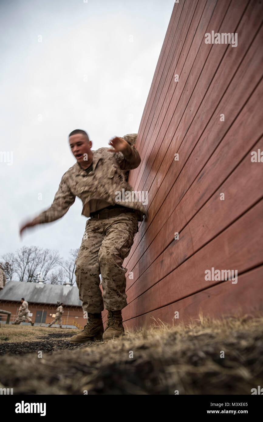 U.S. Marine Corps officer candidates participate in an obstacle course ...