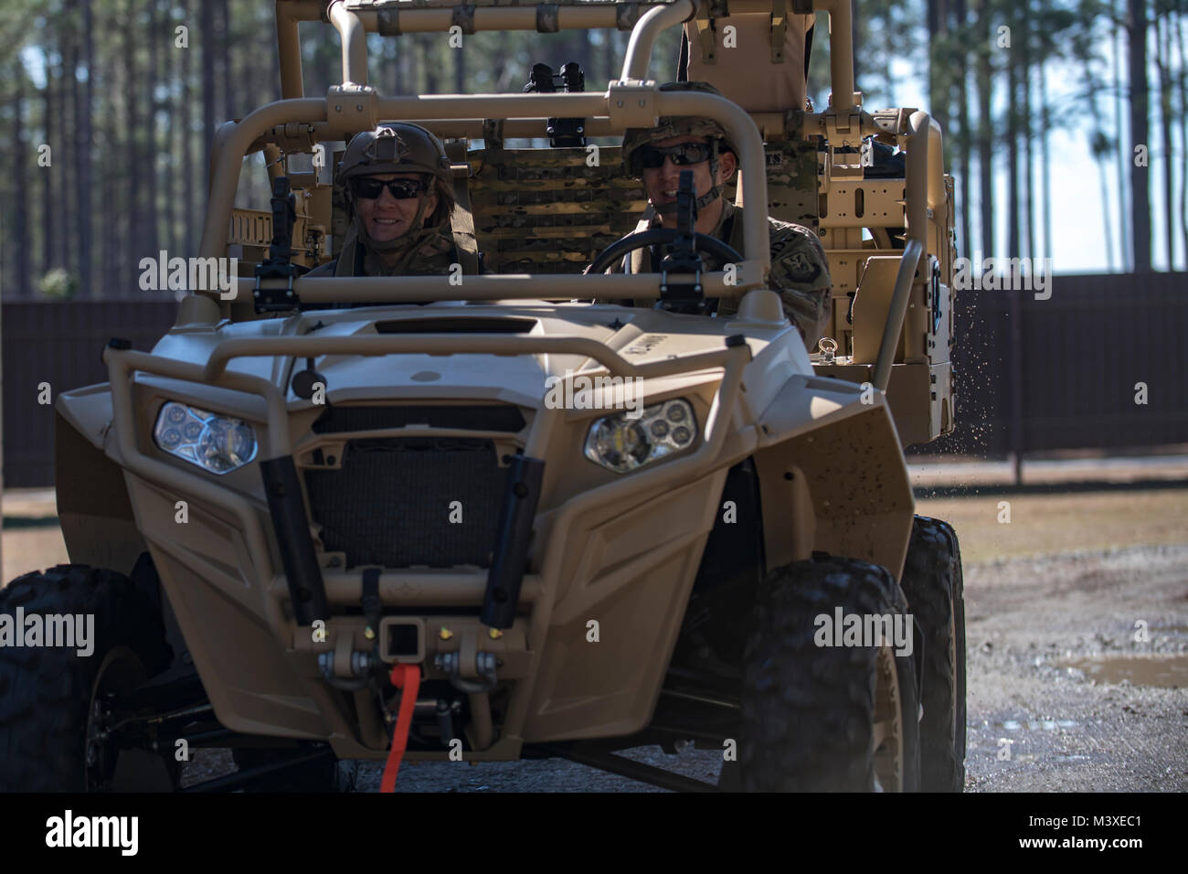An Airman assigned to the 820th Base Defense Group escorts Col ...