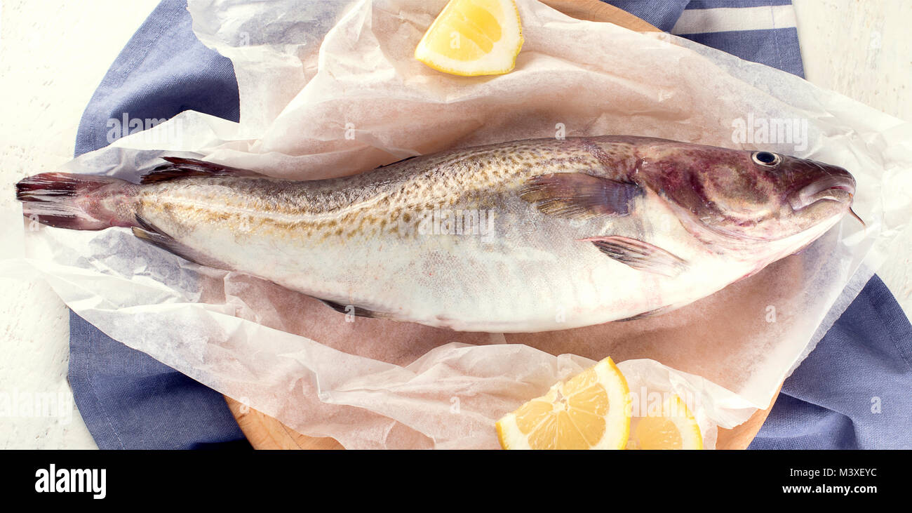 Raw cod fish before cooking. Top view Stock Photo - Alamy