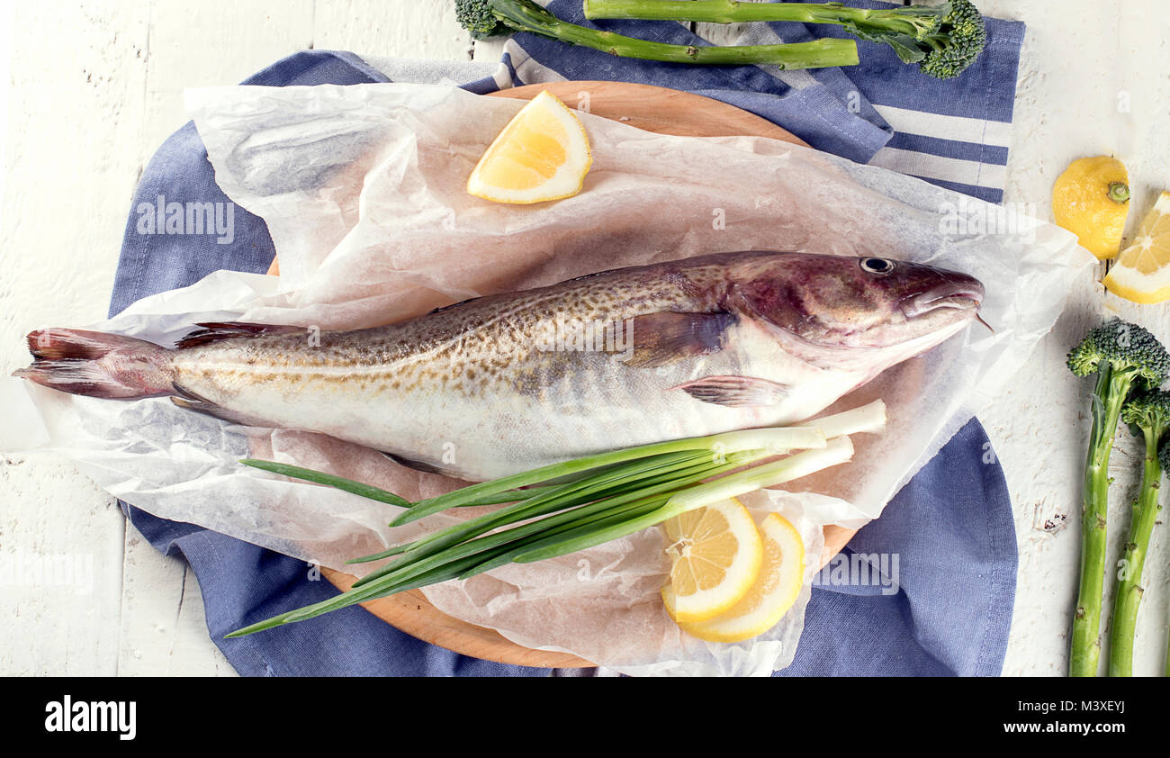 Raw cod fish before cooking. Top view Stock Photo - Alamy