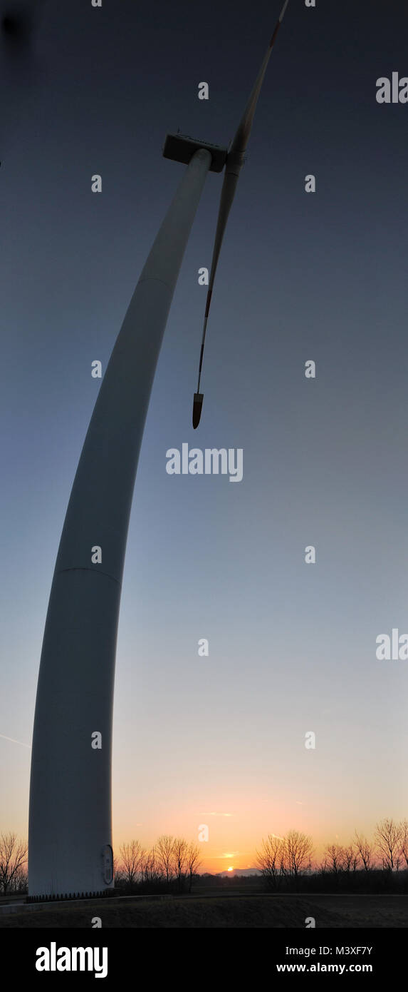 high windmill at sunset with trees in the summer Stock Photo - Alamy