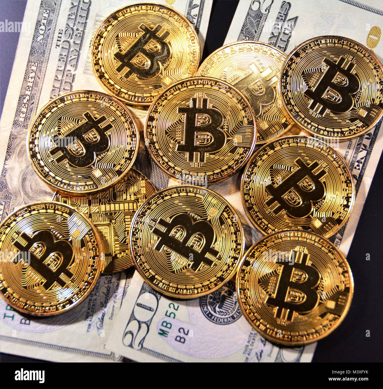 Bit coins with silver dollars and diamonds Stock Photo - Alamy