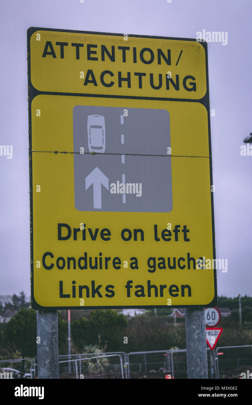 Warning sign outside the airport to remind people to drive on the left ...