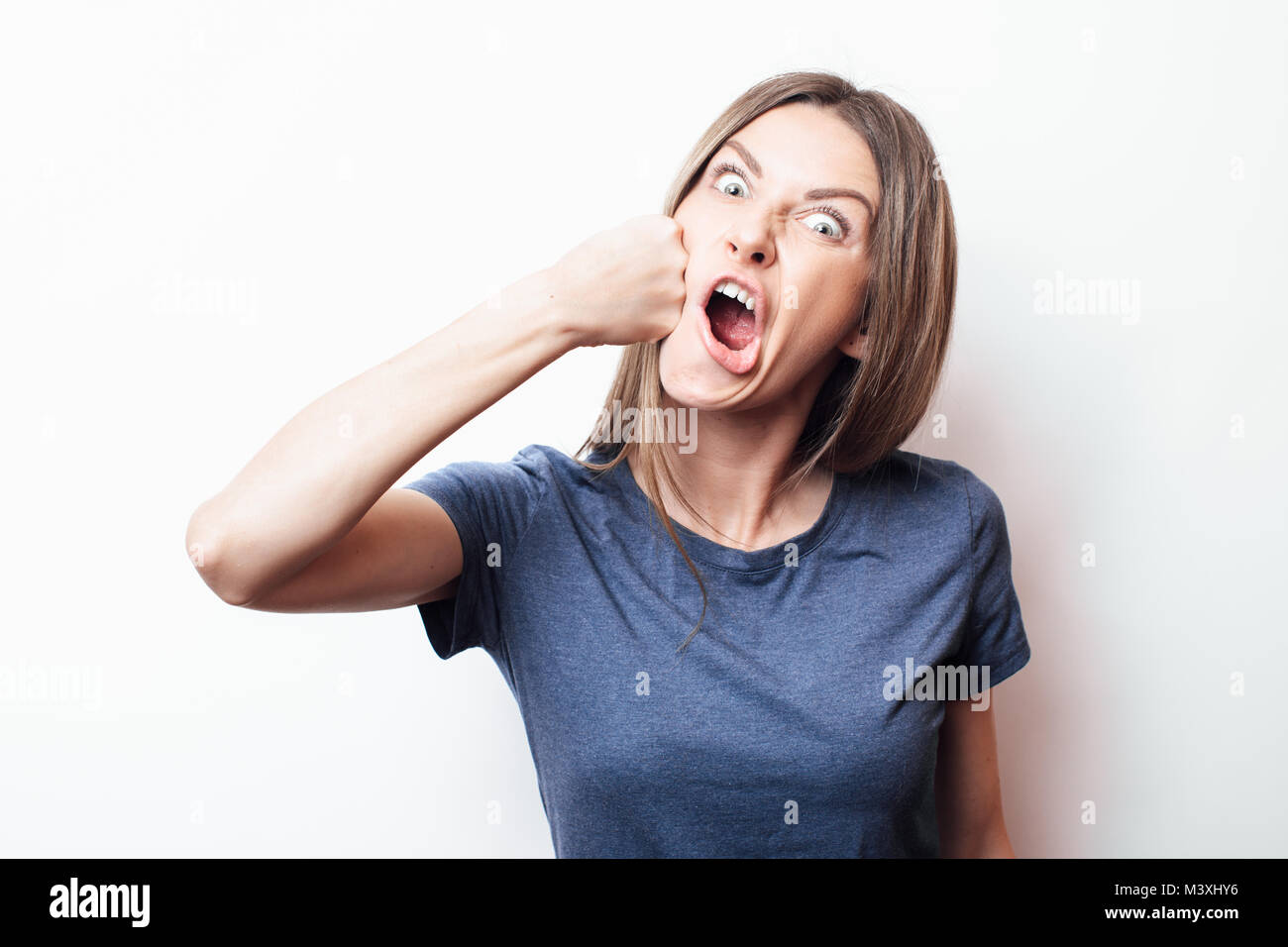 Close up isolated portrait of young annoyed angry woman holding hands ...