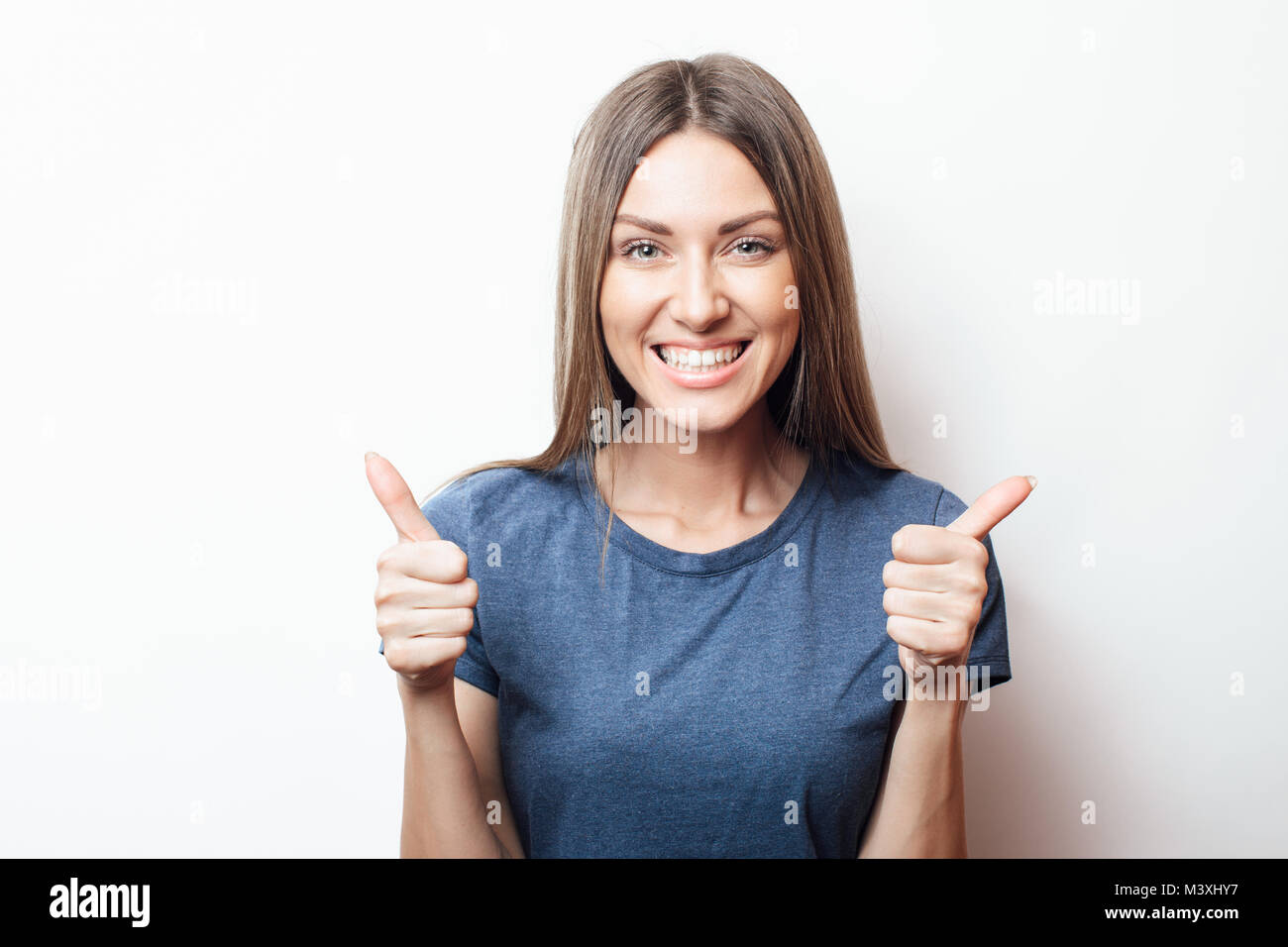 Portrait Of Young Beautiful Cute Cheerful Girl Smiling Looking At