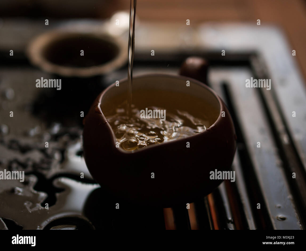 Green Tea Pouring in Traditional Chinese Tea Ceremony Stock Photo - Alamy