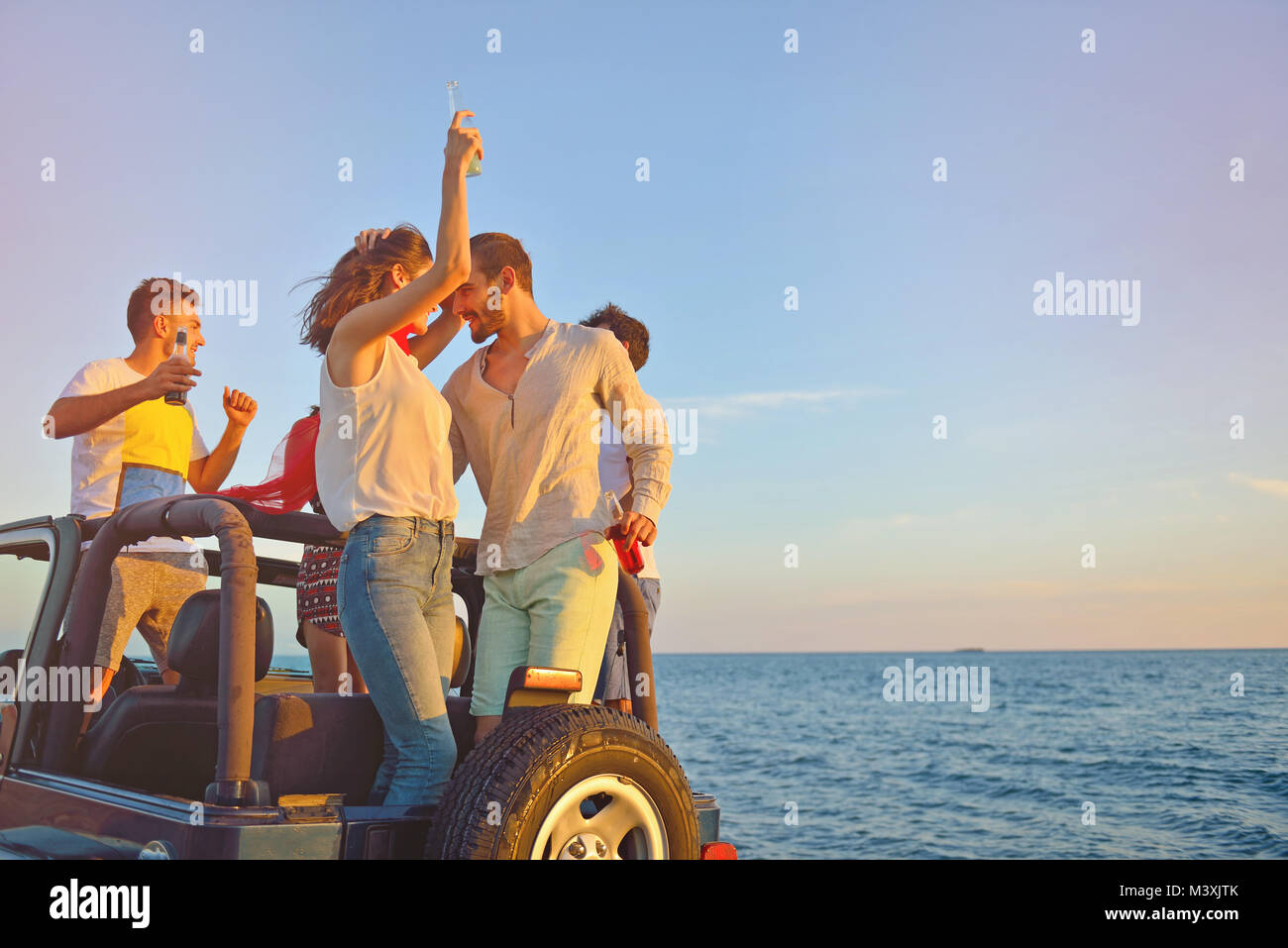 Group of happy friends making party in car - Young people having fun ...