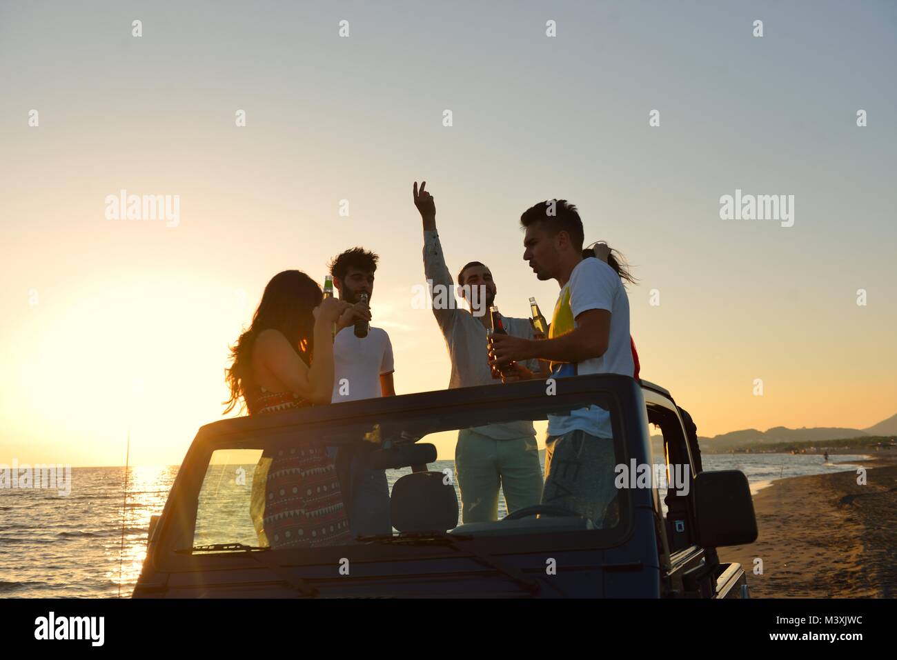 Group of happy friends making party in car - Young people having fun ...