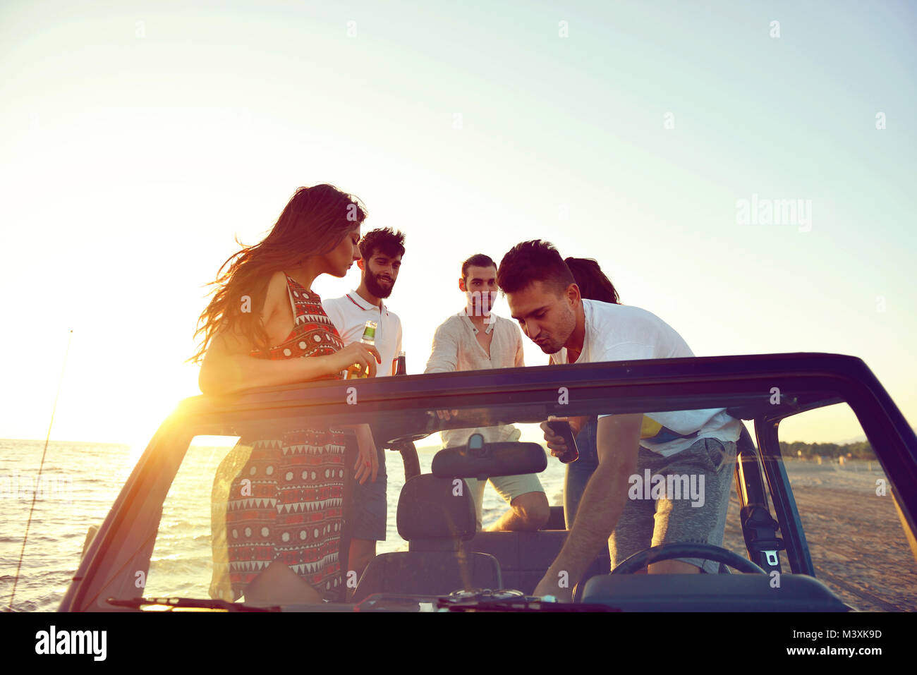 Group of happy friends making party in car - Young people having fun ...