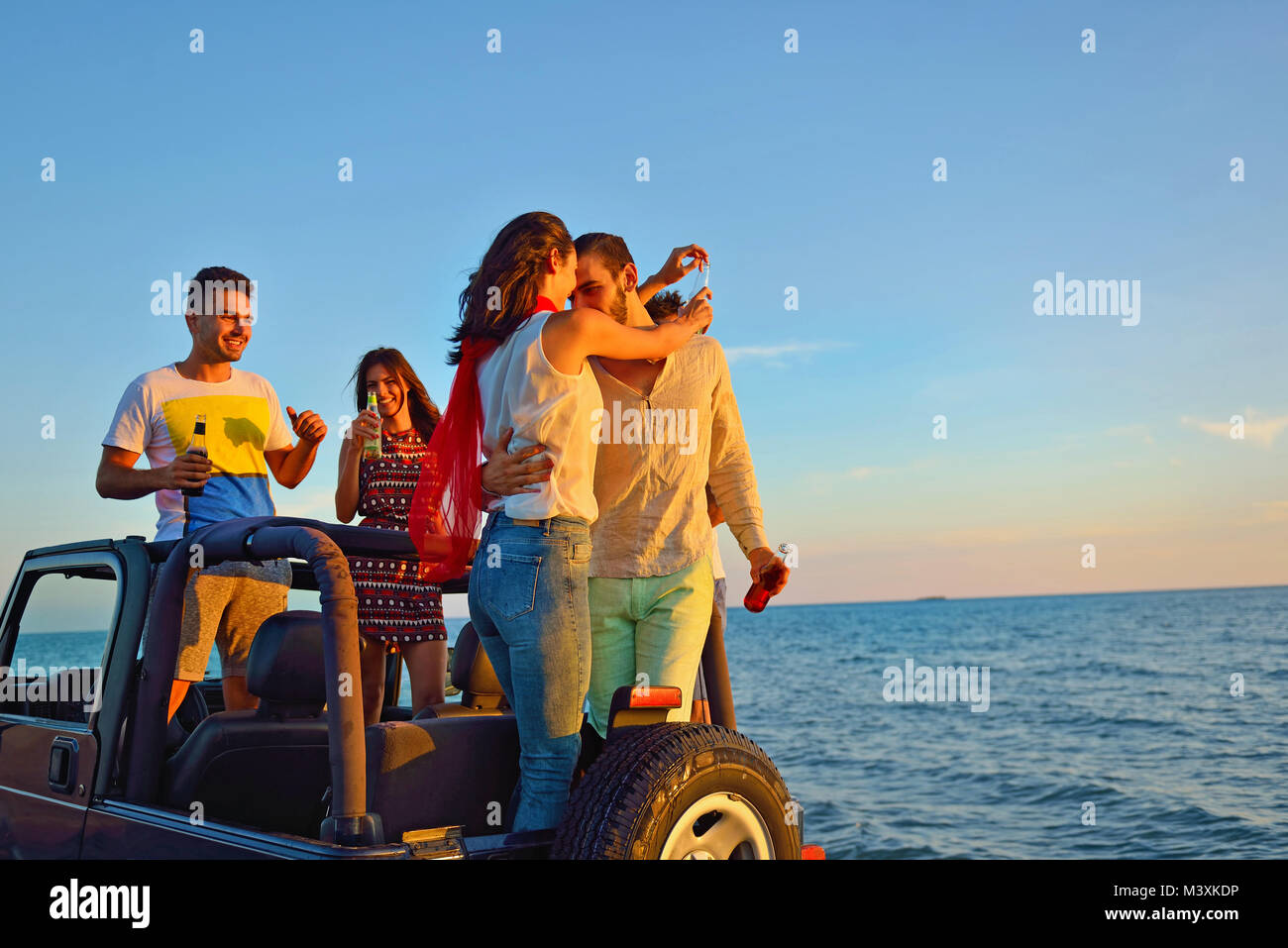 Group of happy friends making party in car - Young people having fun ...