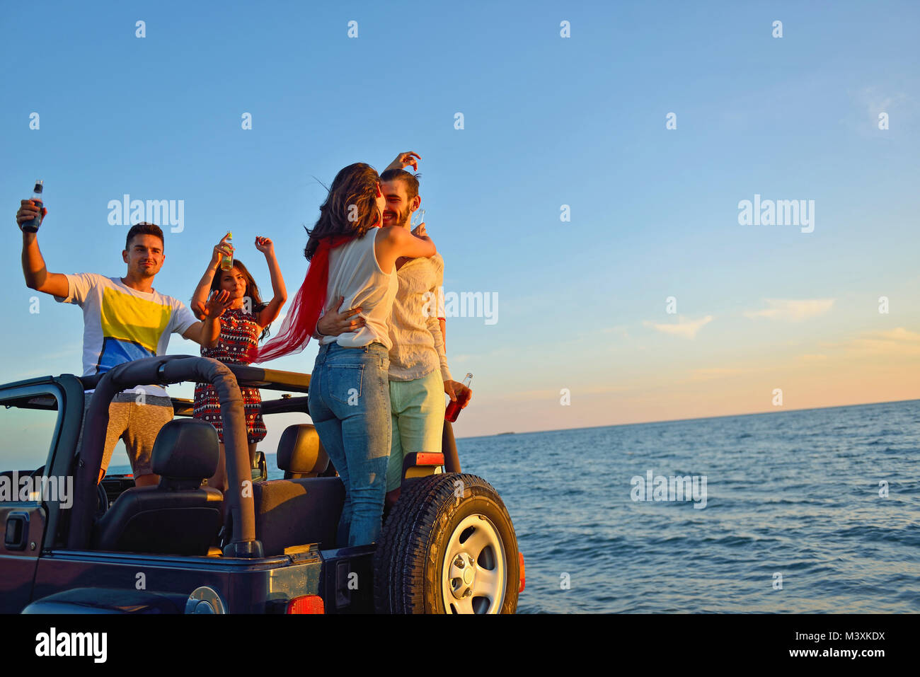 Group of happy friends making party in car - Young people having fun ...