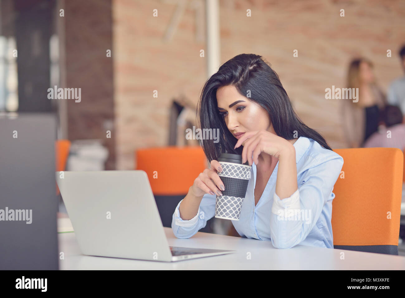 Woman working at computer in an office Stock Photo - Alamy