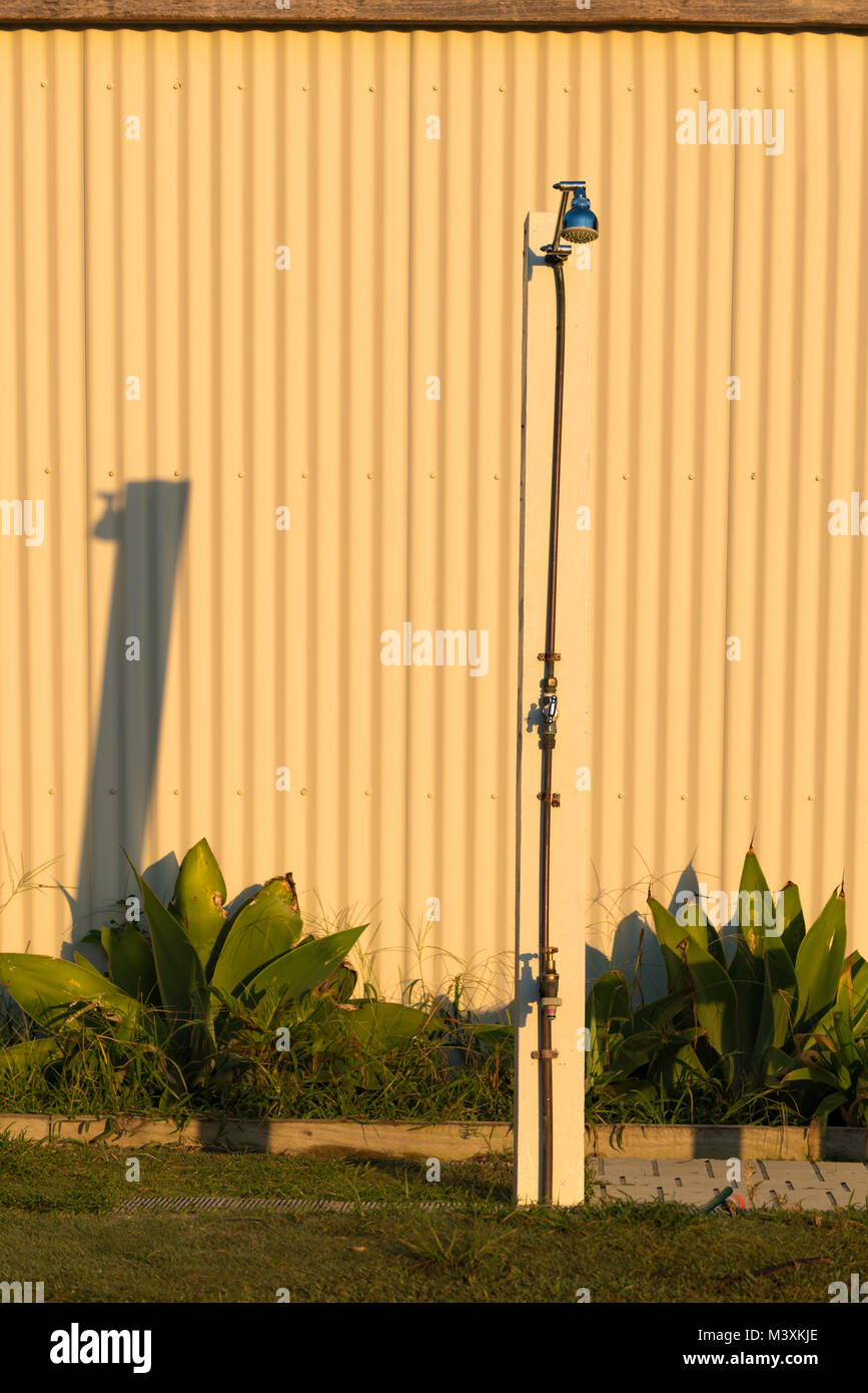 An outside fresh water shower for use by swimmers as they leave the ...